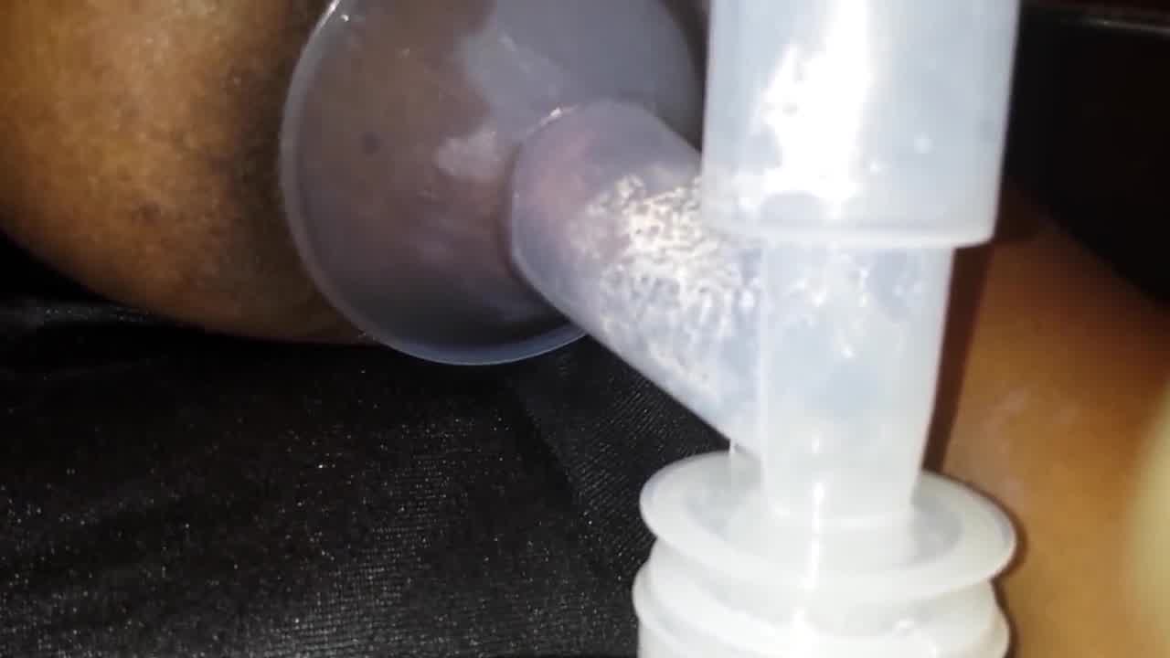 black pumping milk out of her ample hooters and nipples - hotntubes.com